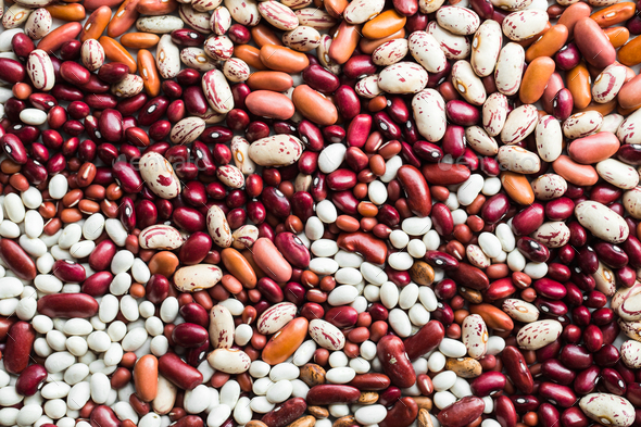 Different varieties of bean seeds. Beans background. Stock Photo by ollinka