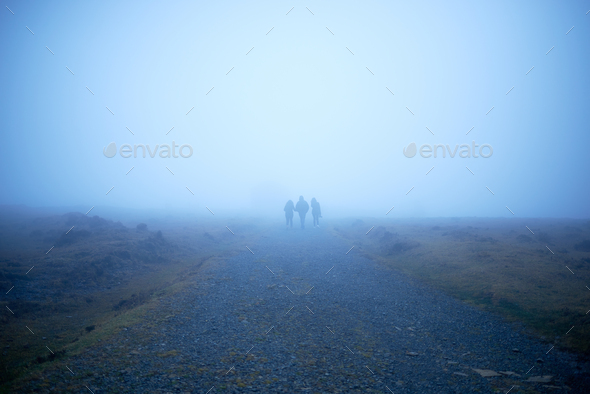 Three people walking into the fog Stock Photo by rubenchase | PhotoDune
