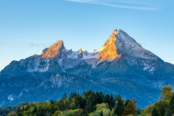 The first sunlight hits the famous Mount Watzmann Stock Photo by elxeneize