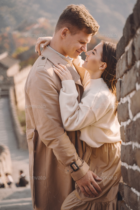 beautiful young couple hugging at the Great Wall of China Stock Photo ...