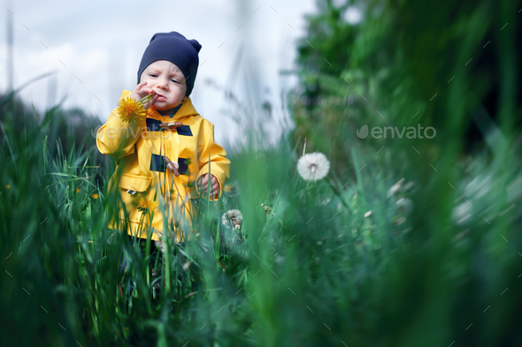 Kid in yellow jacket Stock Photo by ivankmit | PhotoDune