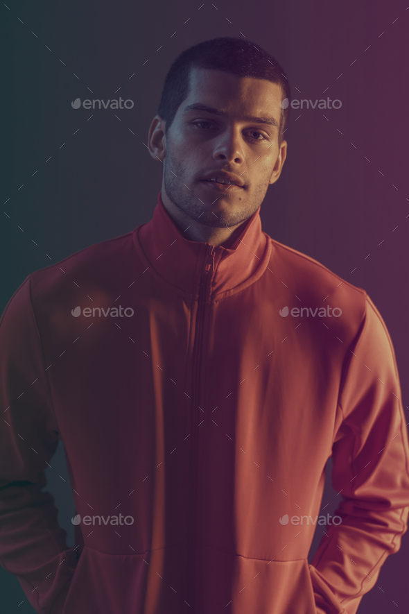 Studio close-up portrait of attractive male model. Color flash studio ...