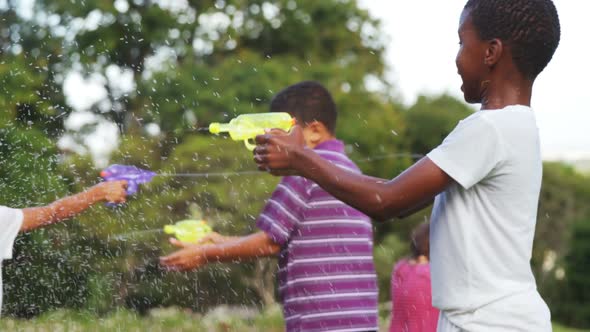 Group of Kids Playing with Water Gun, Stock Footage | VideoHive