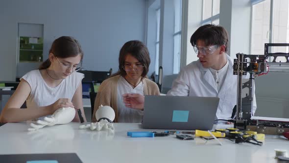 Teacher Moves the 3D Printed Hands and Explains Its Work, Stock Footage