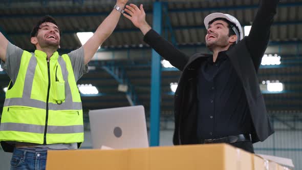 Two Factory Worker Celebrate Success Together in the Factory by ...