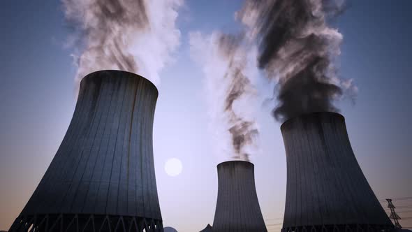 Nuclear power plant steaming cooling towers. Air pollution power ...