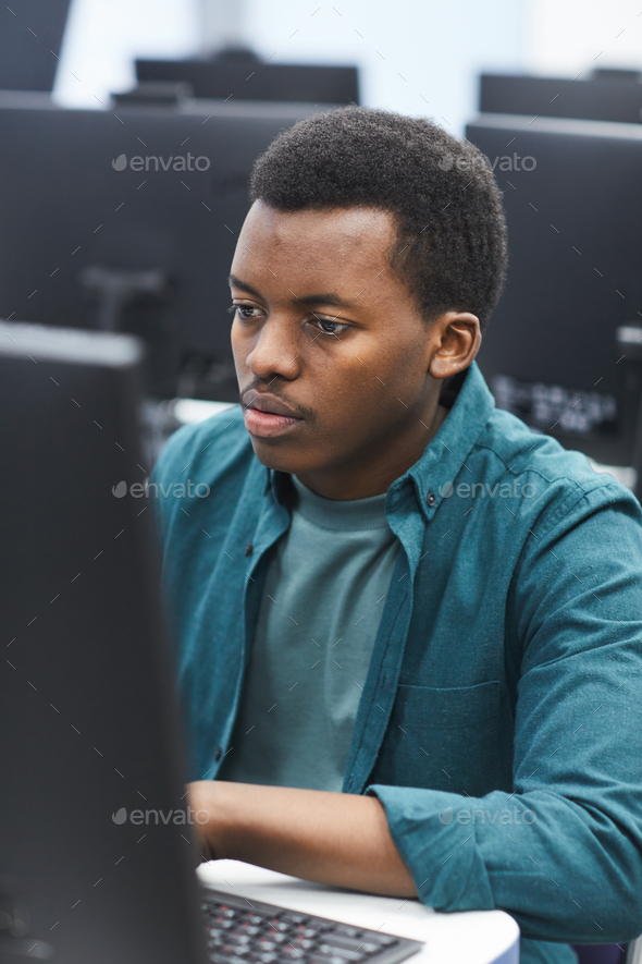 African Student Using Computer in College Stock Photo by seventyfourimages