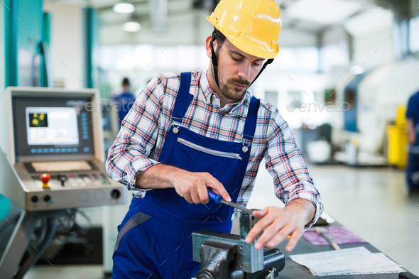 modern industrial machine operator working in factory Stock Photo by nd3000