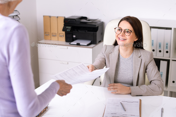 Giving form to social worker Stock Photo by Pressmaster | PhotoDune