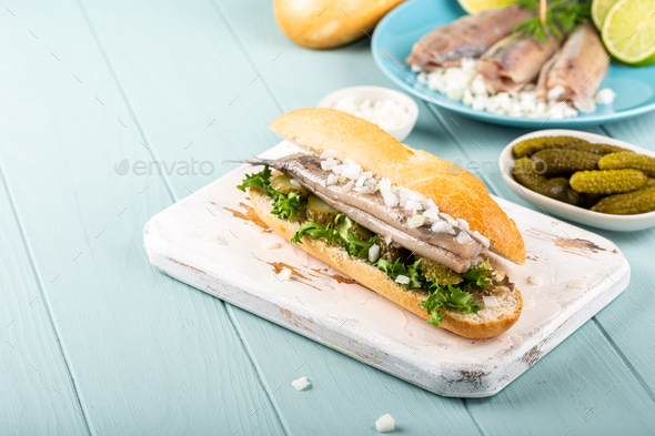 Traditional dutch snack, seafood sandwich with herring Stock Photo by ...