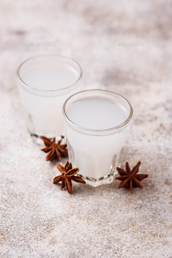 Traditional Greek ouzo, alcohol drink with anise Stock Photo by furmanphoto