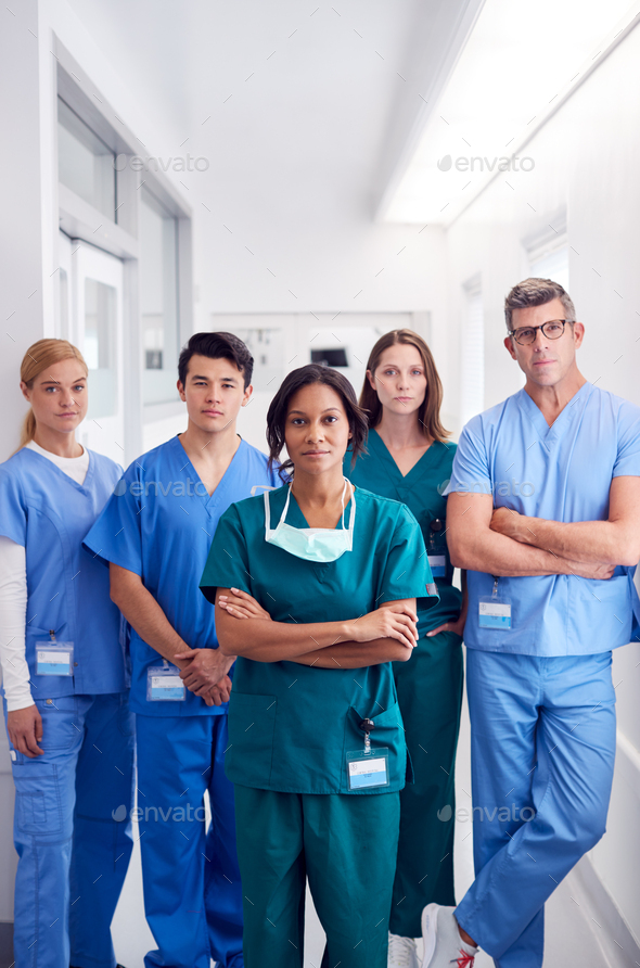 Portrait Of Multi-Cultural Medical Team Standing In Hospital Corridor ...