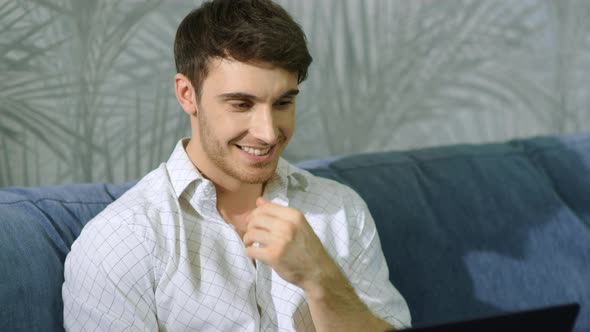 Happy Man Looking Computer Screen Indoors. Happy Guy Using Laptop at ...