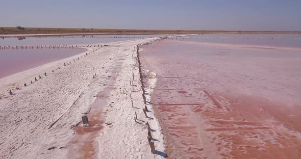 Flight over a pink saline lake, Stock Footage | VideoHive