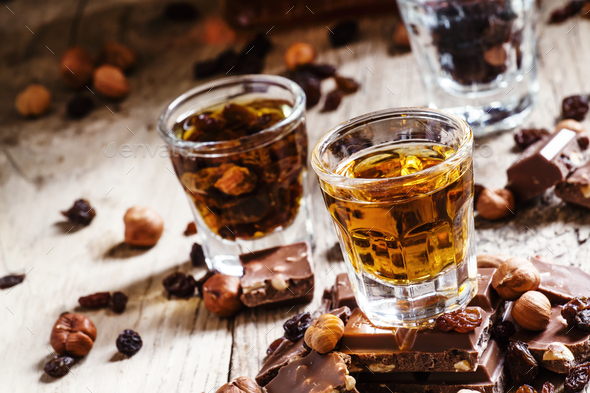 Brandy, chocolate with nuts and raisins Stock Photo by 5PH | PhotoDune