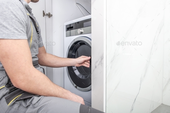 Washing Machine Installation Stock Photo by duallogic | PhotoDune