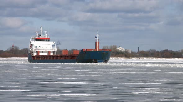 Cargo Ship Sailing Through Frozen Sea Ice In Winter, Stock Footage