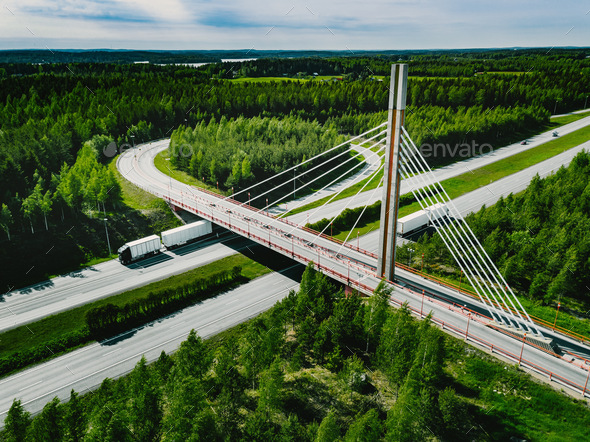 Aerial top view of cable-stayed Suspension bridge and Highway road with ...