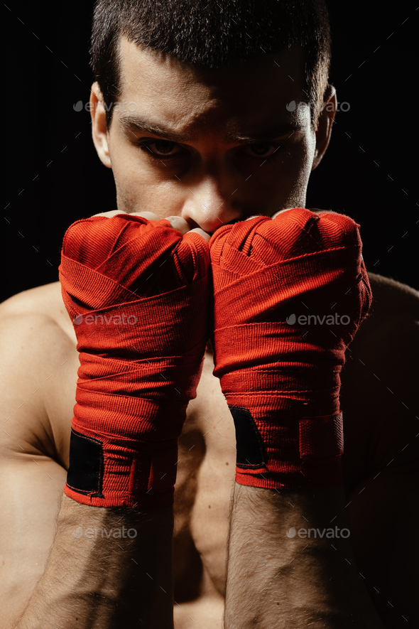 Boxer male fighter posing in confident defensive stance with hands in ...