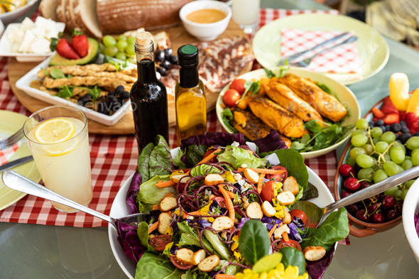 Food on an outdoor dinner table Stock Photo by Wavebreakmedia | PhotoDune