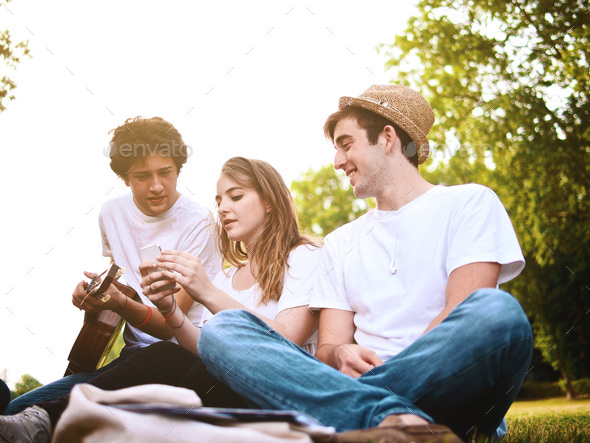 large group of students playing a music in a campus Stock Photo by jpozzi
