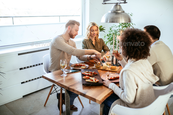 Sharing good food with good friends Stock Photo by bernardbodo | PhotoDune