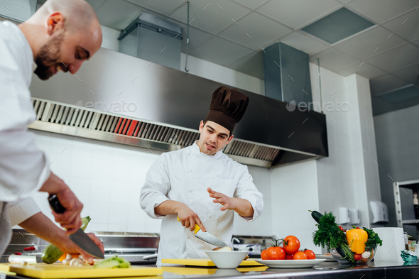 Learning from a master chef Stock Photo by bernardbodo | PhotoDune