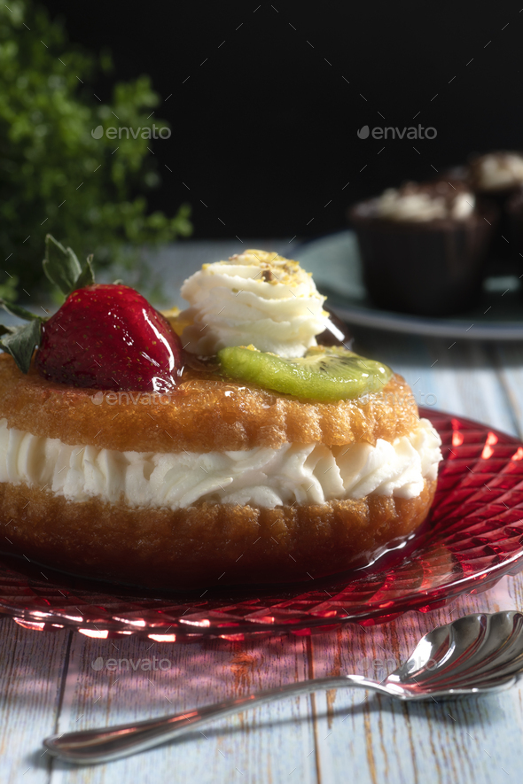 Italian sweet Baba with rum syrup Stock Photo by Nick_Paschalis | PhotoDune