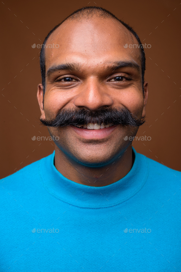 Face of happy Indian man with mustache wearing blue sweater Stock Photo ...