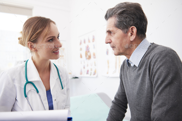 Senior man at a routine visit at his doctor Stock Photo by gpointstudio