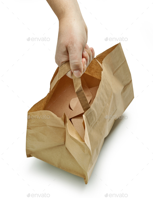 paper bag in human hand Stock Photo by magone | PhotoDune