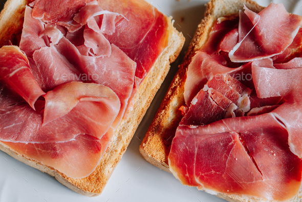 Toasts with serrano ham, traditional spanish breakfast Stock Photo by ...