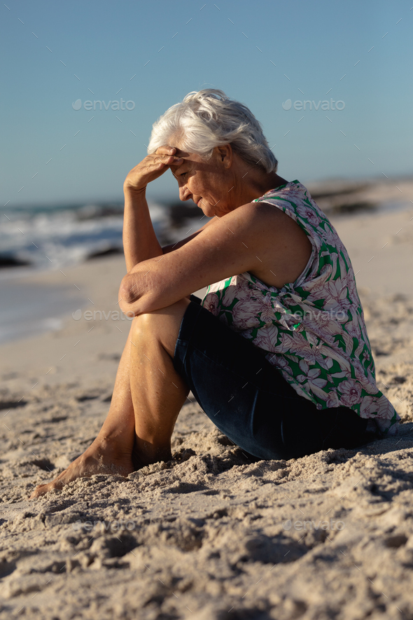 Old woman relaxing at the beach Stock Photo by Wavebreakmedia | PhotoDune
