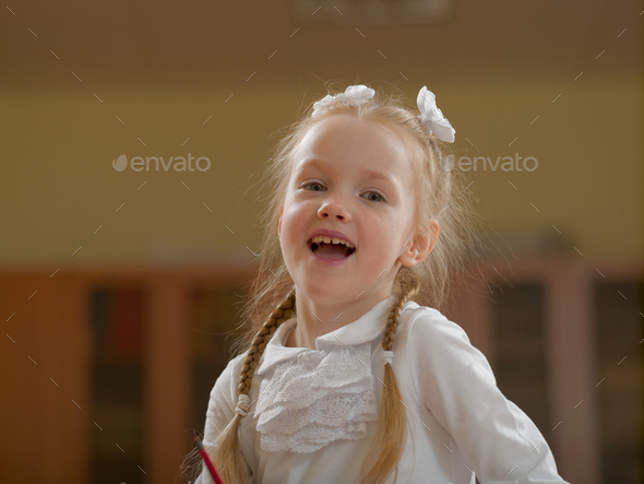 Little girl in school class at the lesson Stock Photo by oleghz | PhotoDune