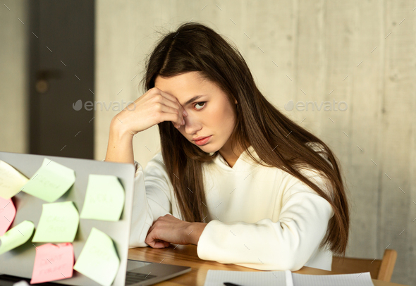 Girl in front of computer with task stickers Stock Photo by Prostock-studio