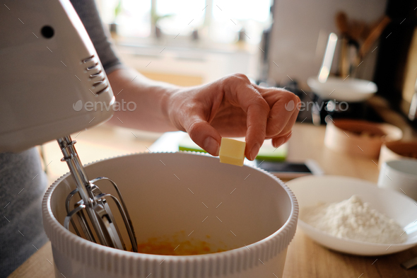 Woman hands using a white handheld mixer Stock Photo by arthurhidden