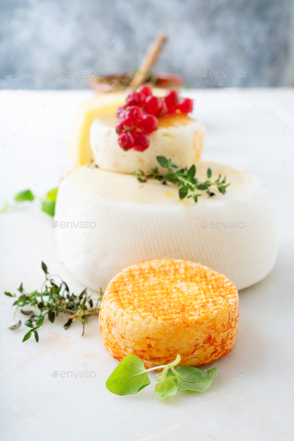 Traditional Portuguese semi-soft cheeses Stock Photo by SebastianaRaw