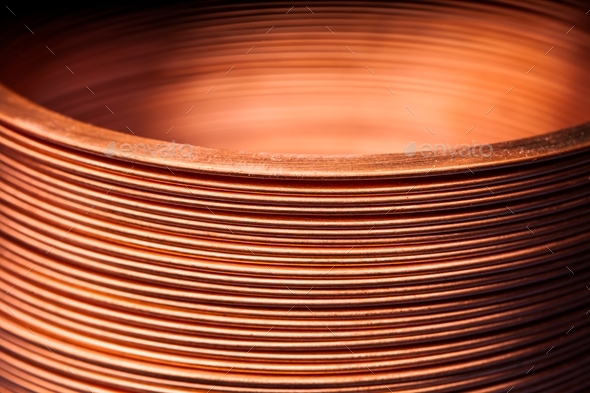 Close-up flat twisted copper wire at a factory Stock Photo by YouraPechkin