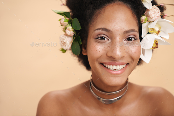 Portrait Of Half Naked African American Woman With Flowers In Her Hair