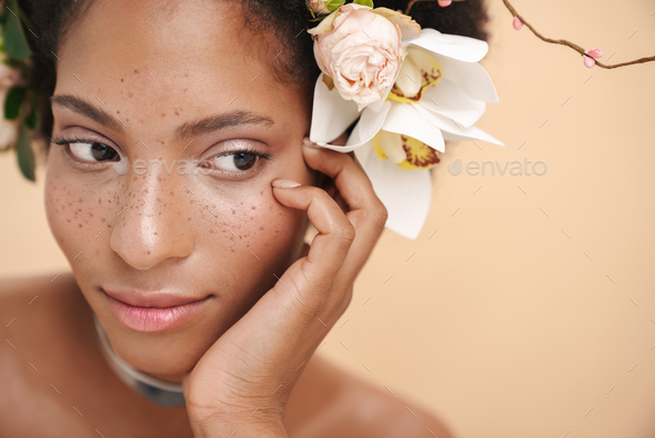 Portrait Of Half Naked African American Woman With Flowers In Her Hair