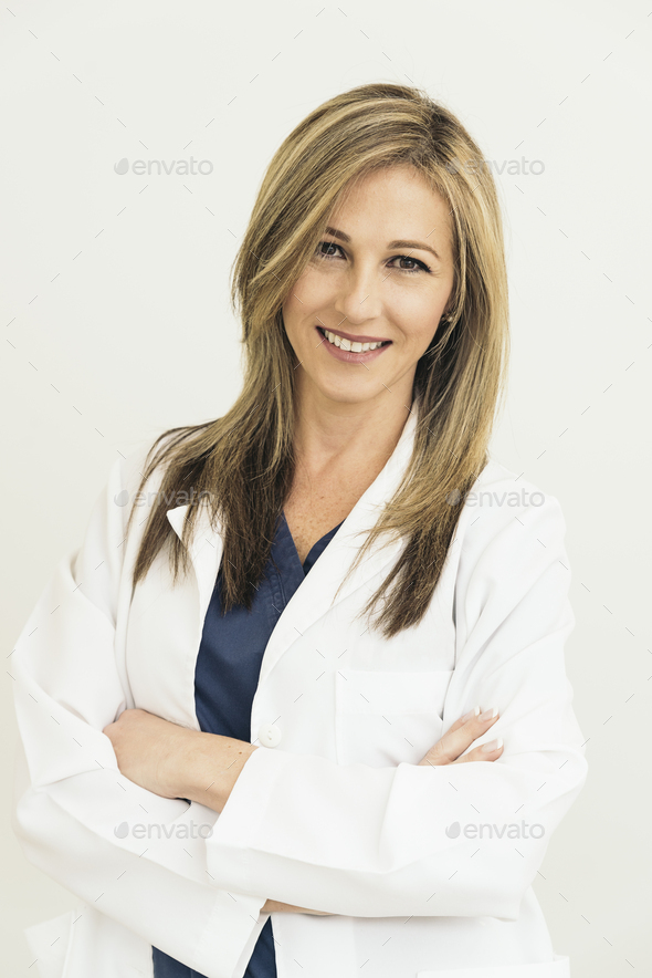 Smiling beautiful doctor at hospital. Stock Photo by nunezimage | PhotoDune