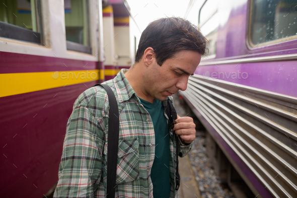 Sad tourist man at the railway station in Bangkok Thailand Stock Photo ...