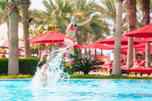 Family of mom and little daughter enjoying summer vacation in luxury ...