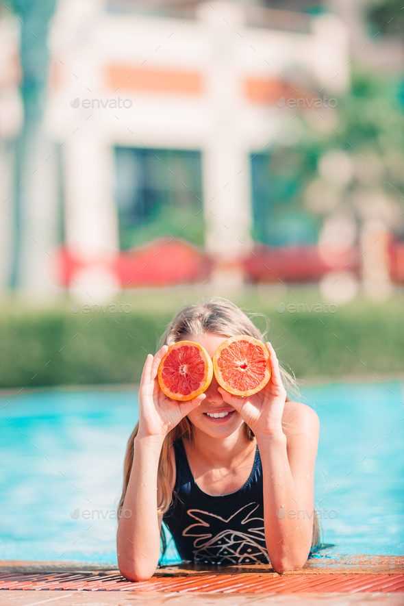 Little adorable girl in outdoor swimming pool Stock Photo by ...