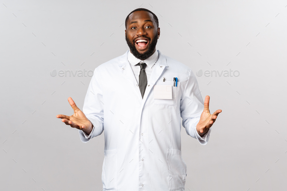 Happy african american doctor at clinic or hospital welcoming patient ...