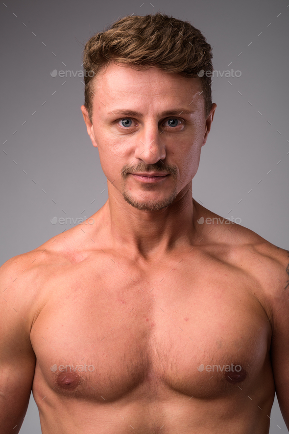 Face of muscular handsome bearded man shirtless Stock Photo by ...