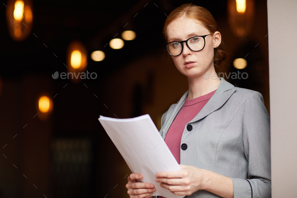Serious businesswoman with document Stock Photo by AnnaStills | PhotoDune