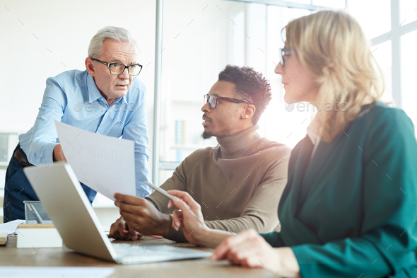 Business people doing paper work Stock Photo by AnnaStills | PhotoDune