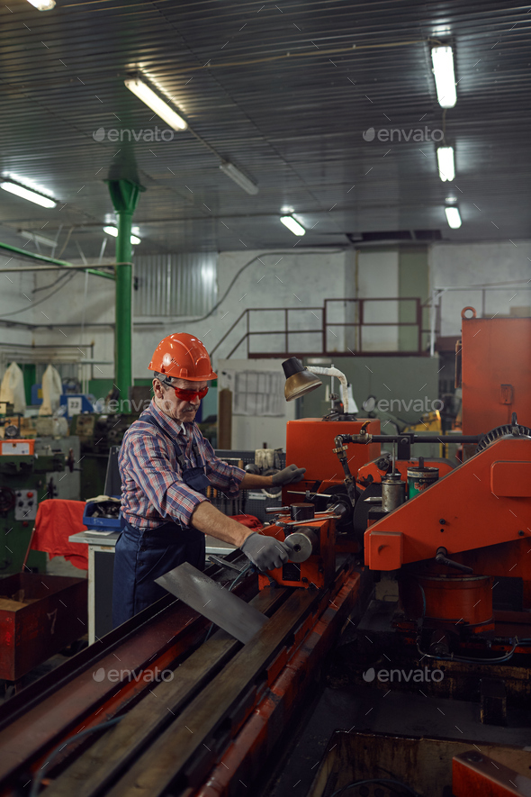 Engineer controlling the machine Stock Photo by AnnaStills | PhotoDune