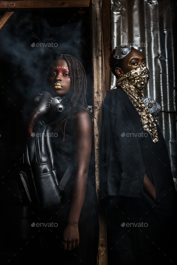 Photo of two women standing in smoke putting on face masks Stock Photo ...